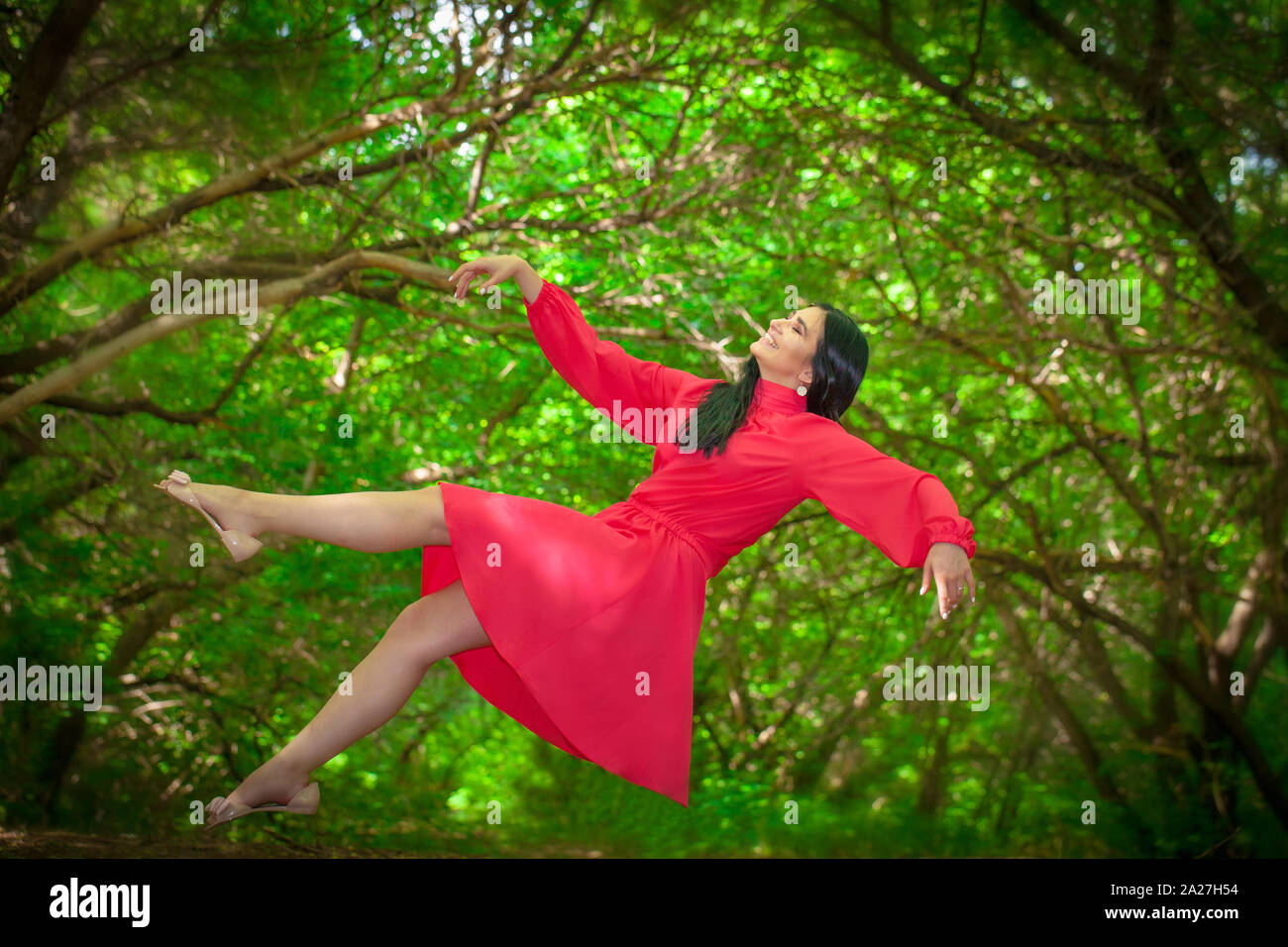 The concept of levitation. Woman soars in the air. Man in flight. The ...