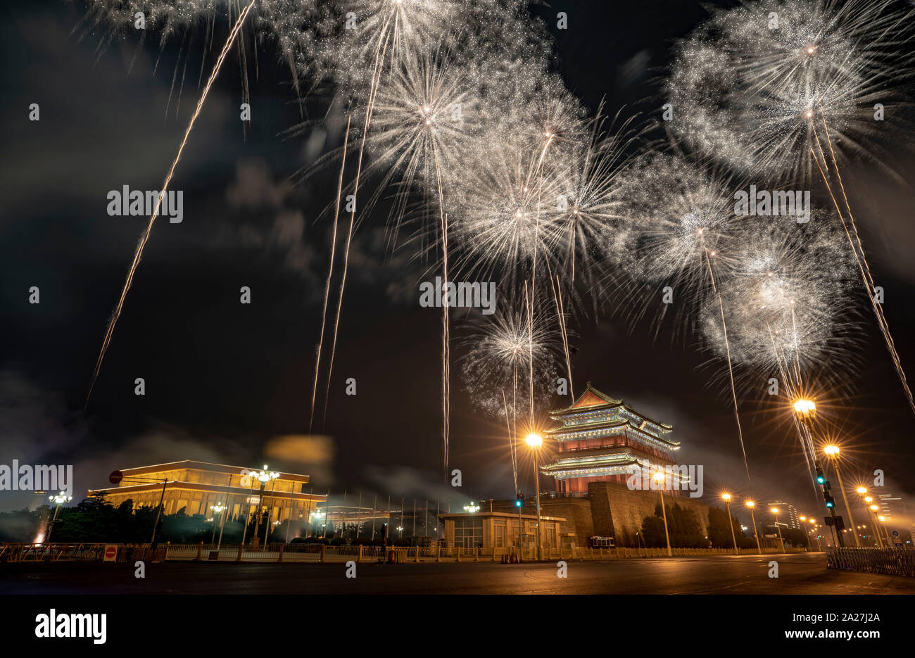 Beijing, China. 1st Oct, 2019. Fireworks explode during a grand evening ...