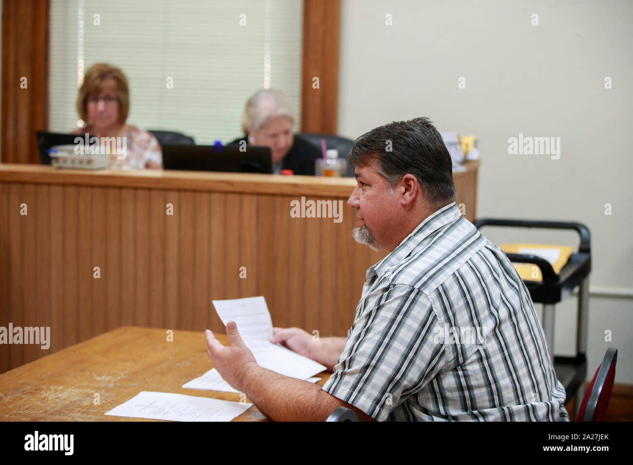 Spencer community member Scott Winders presents a petition with 1046 ...