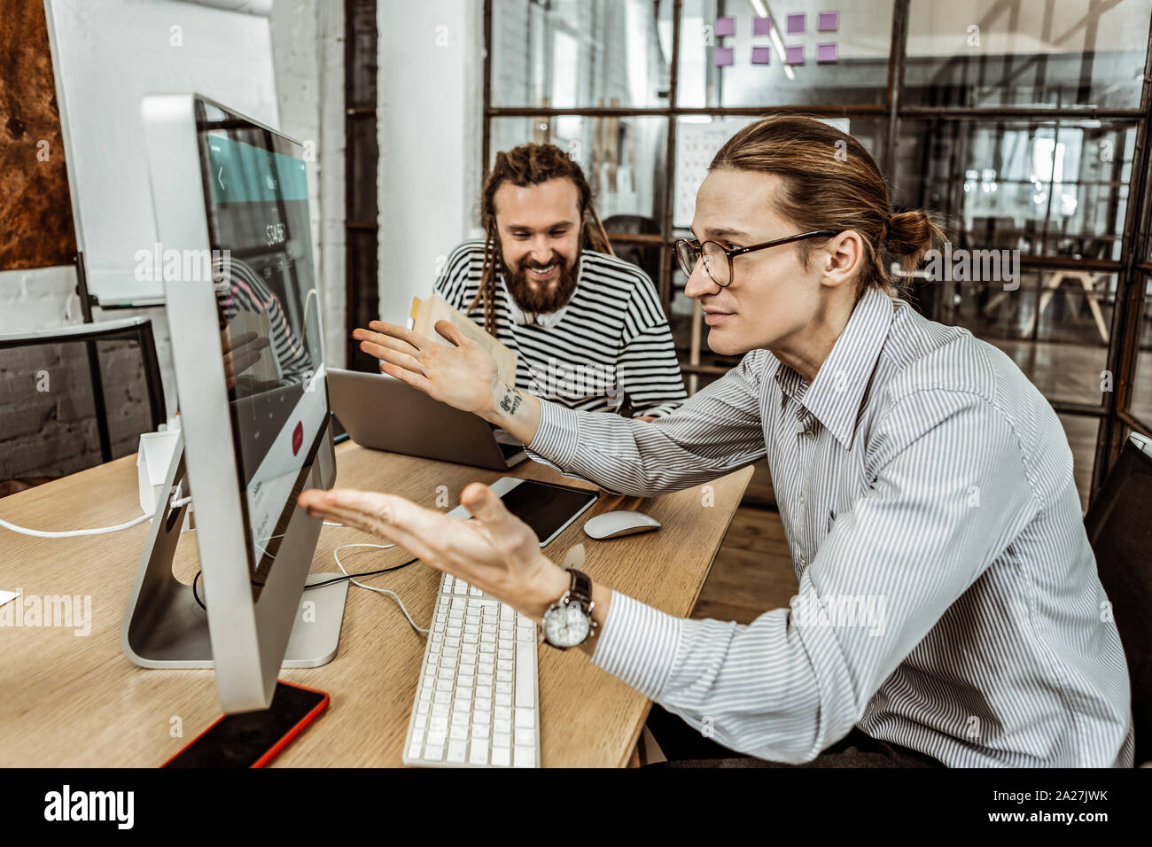 Cannot understand. Attentive male person sitting in semi position and ...
