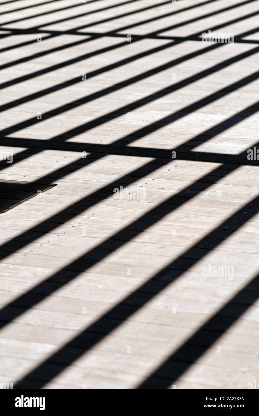Graphic abstract shadow lines on a clean modern stone architecture ...