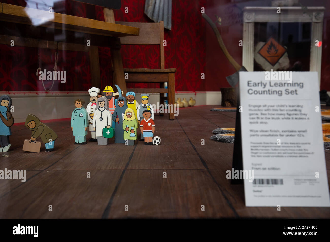 A toddler's counting toy, where children are encouraged to load wooden ...