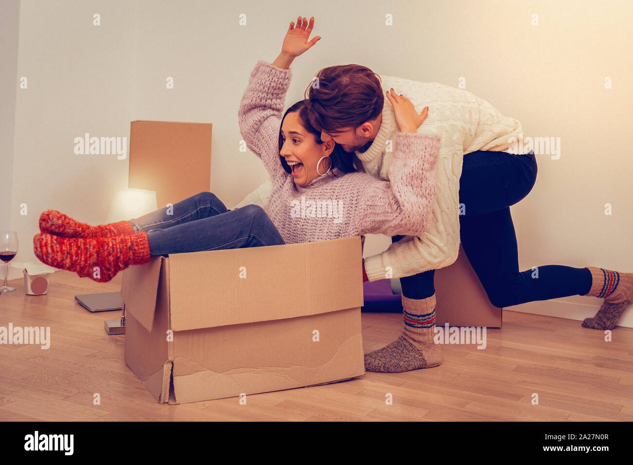 Handsome husband helping happy hi-res stock photography and images - Alamy