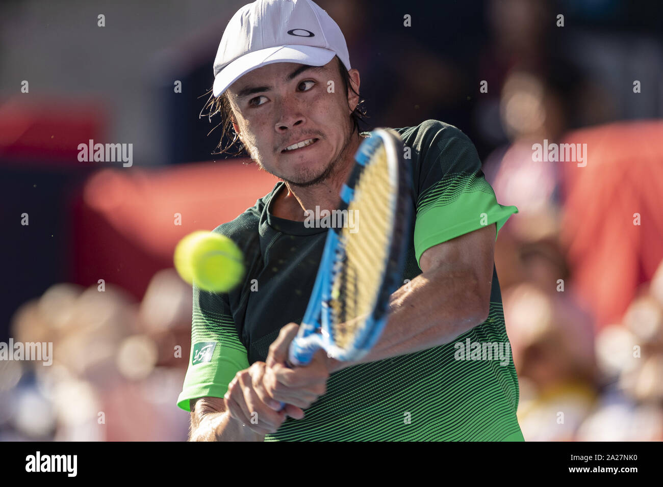 Tokyo, Japan. 1st Oct, 2019. Taro Daniel (JPN) hits a return against ...