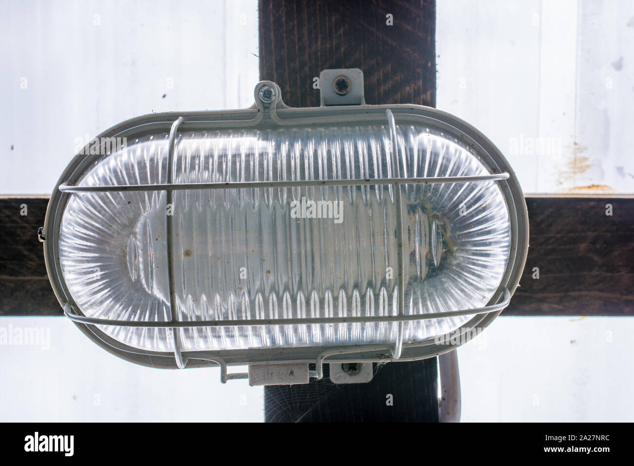 Lamp in weatherproof housing Stock Photo - Alamy