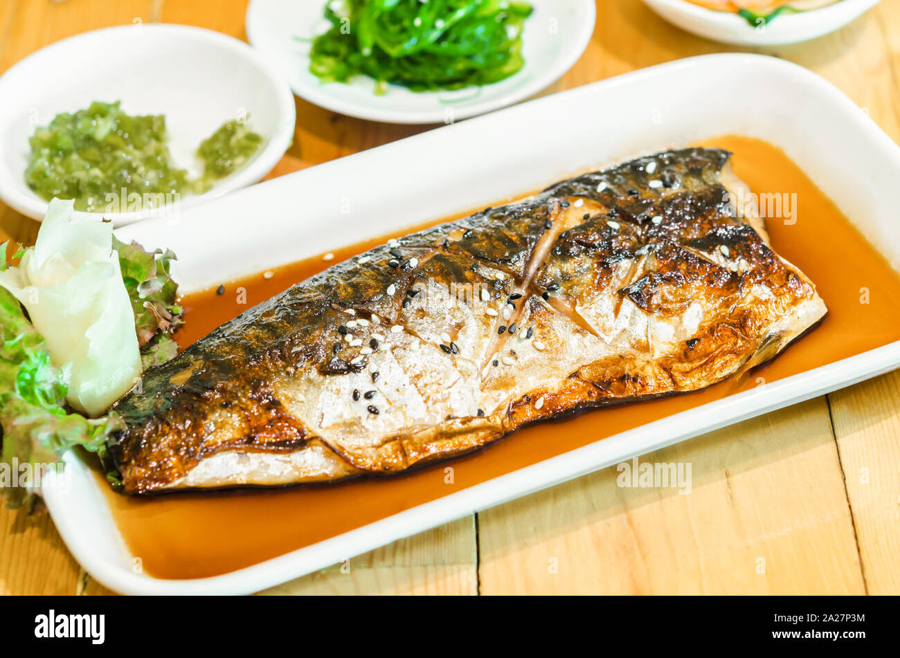 Saba or mackerel fish grilled with soy sauce with black and white ...
