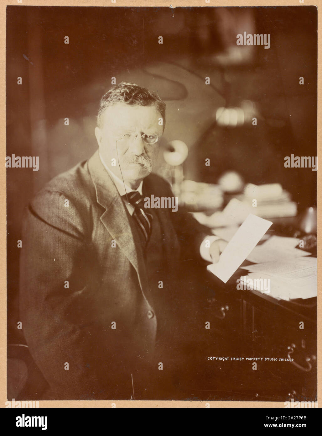 President Theodore Roosevelt at a desk with papers Stock Photo - Alamy