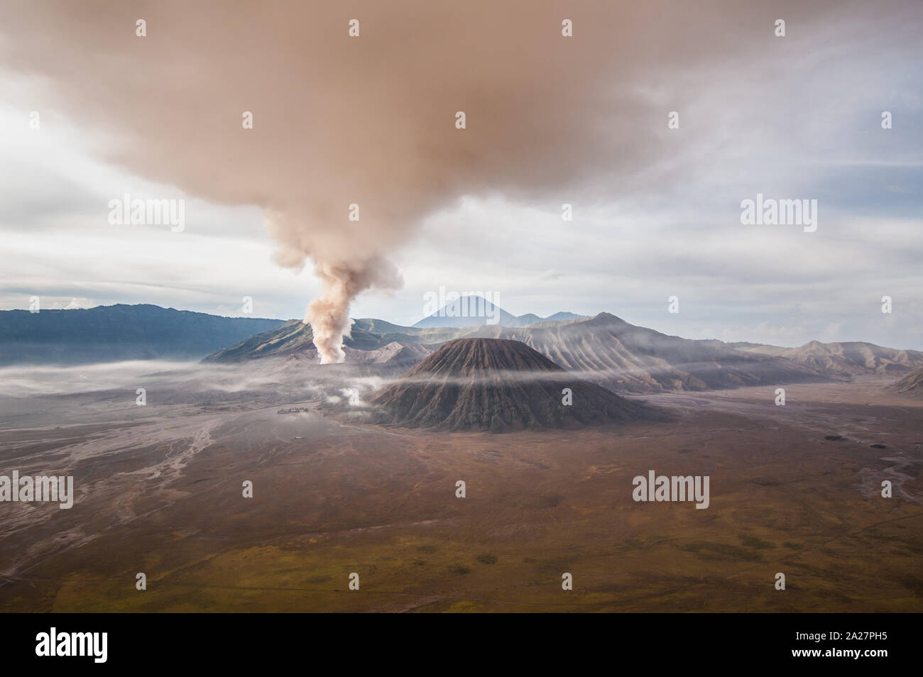 The eruption of mount Bromo darken the surrounding sky Stock Photo - Alamy