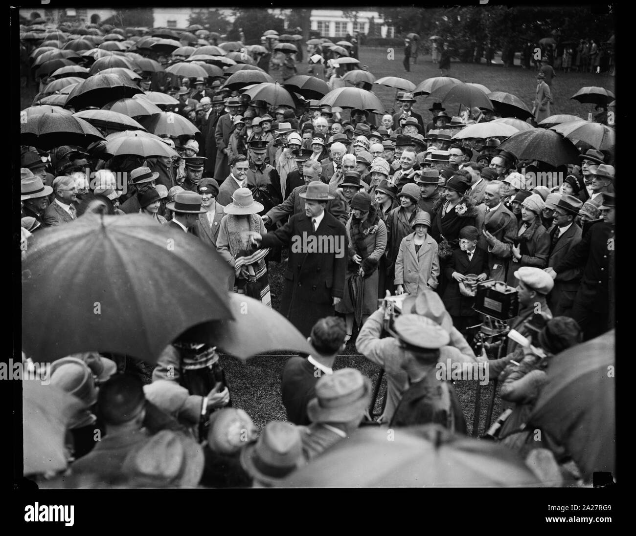 President receives doctors in rain. Braving the wind and rain and ...