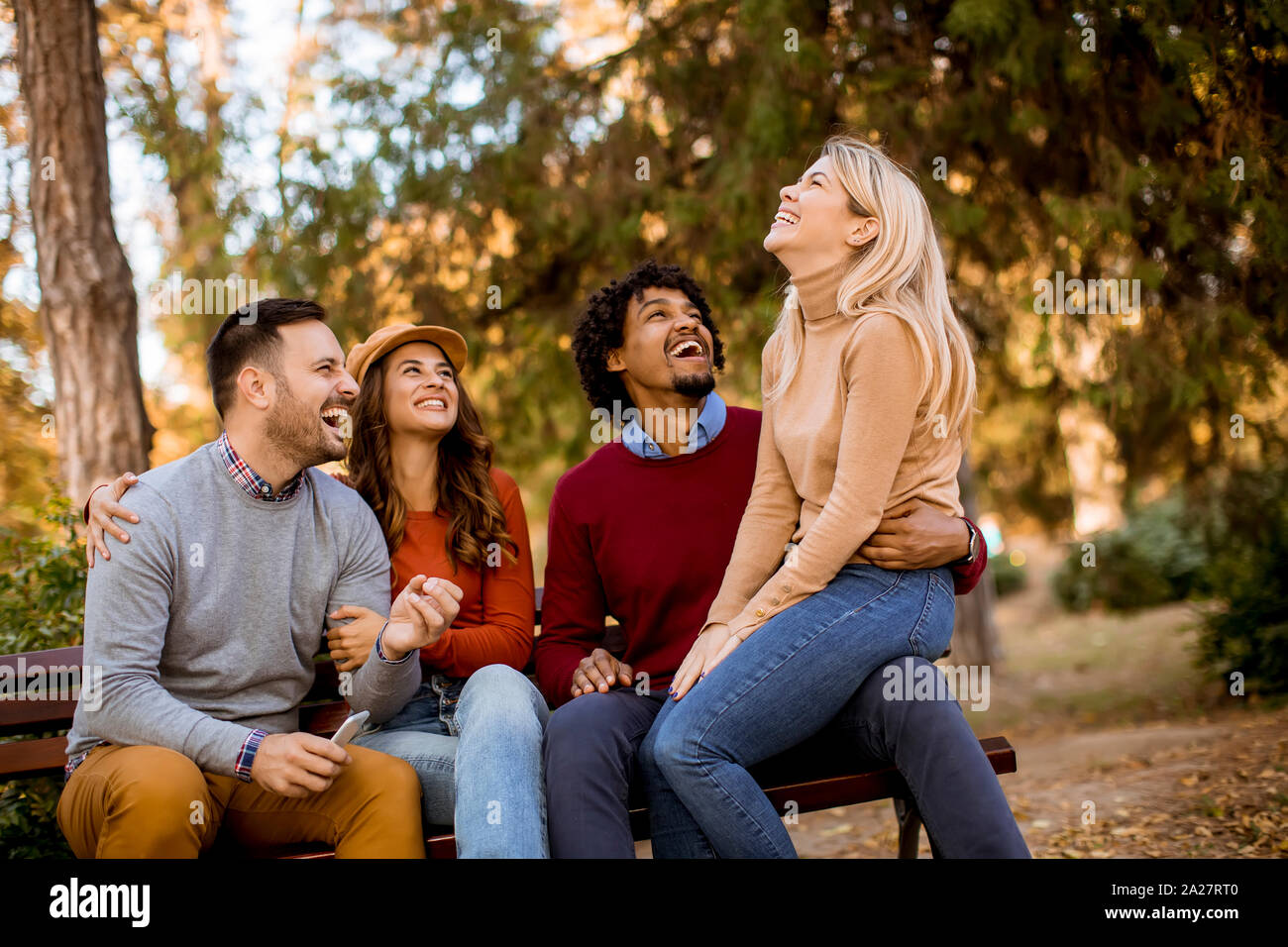 Group of young multiethnic friends having fun at autumn park Stock ...
