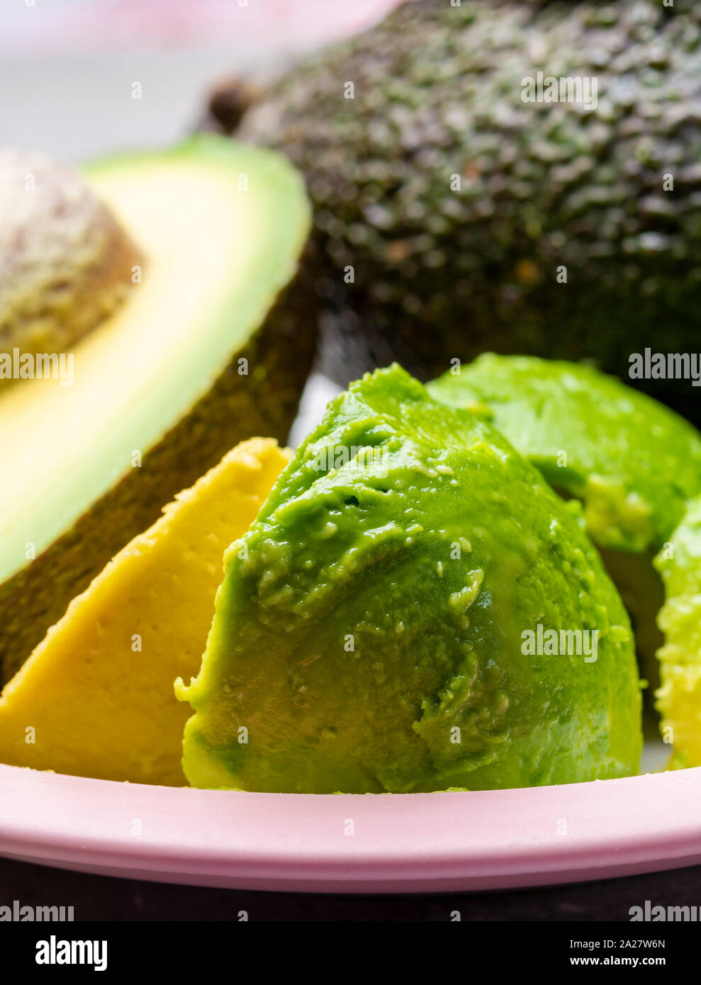 Eating of fresh ripe green organic hass avocado tropical fruit Stock ...