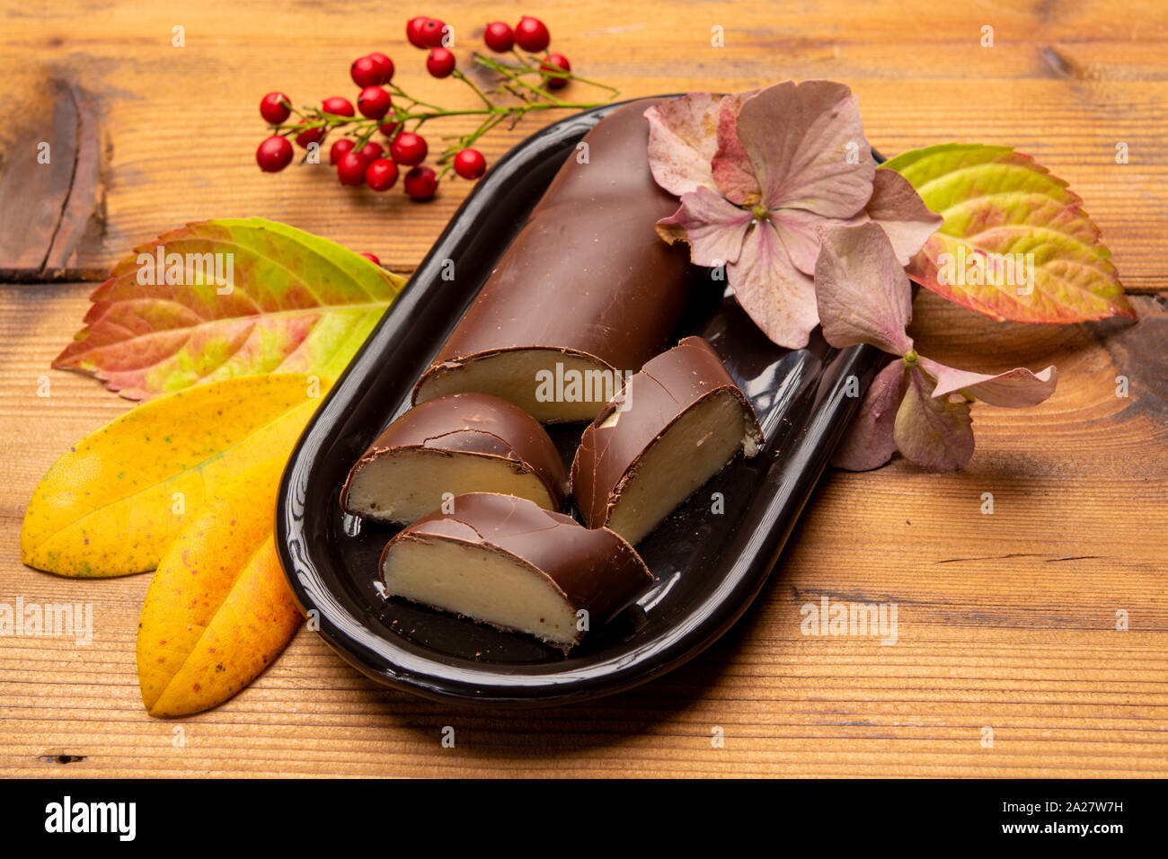 Dutch chocolate candy filled with white marzipan in autumn colors on ...