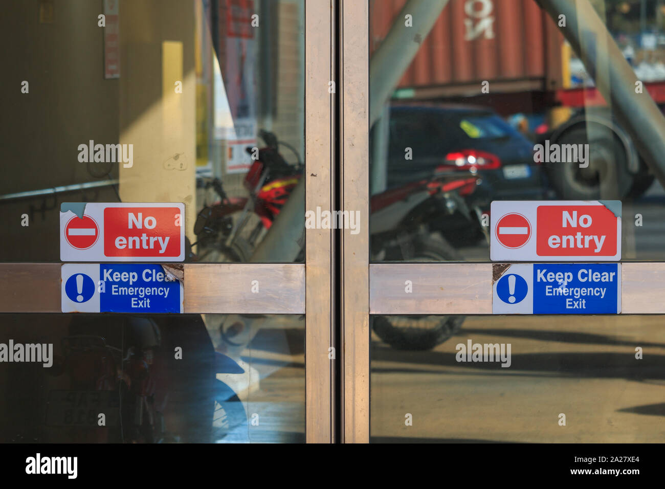 Emergency exit sign on glass hi-res stock photography and images - Alamy