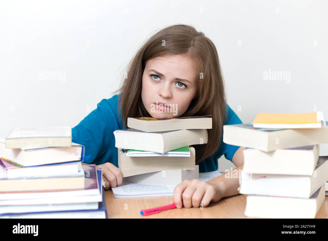 Young caucasian girl woman with many books study at school or ...