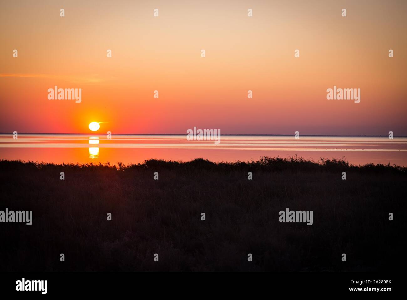 happy weekend by the sea. landscape and a beautiful sunset Stock Photo ...