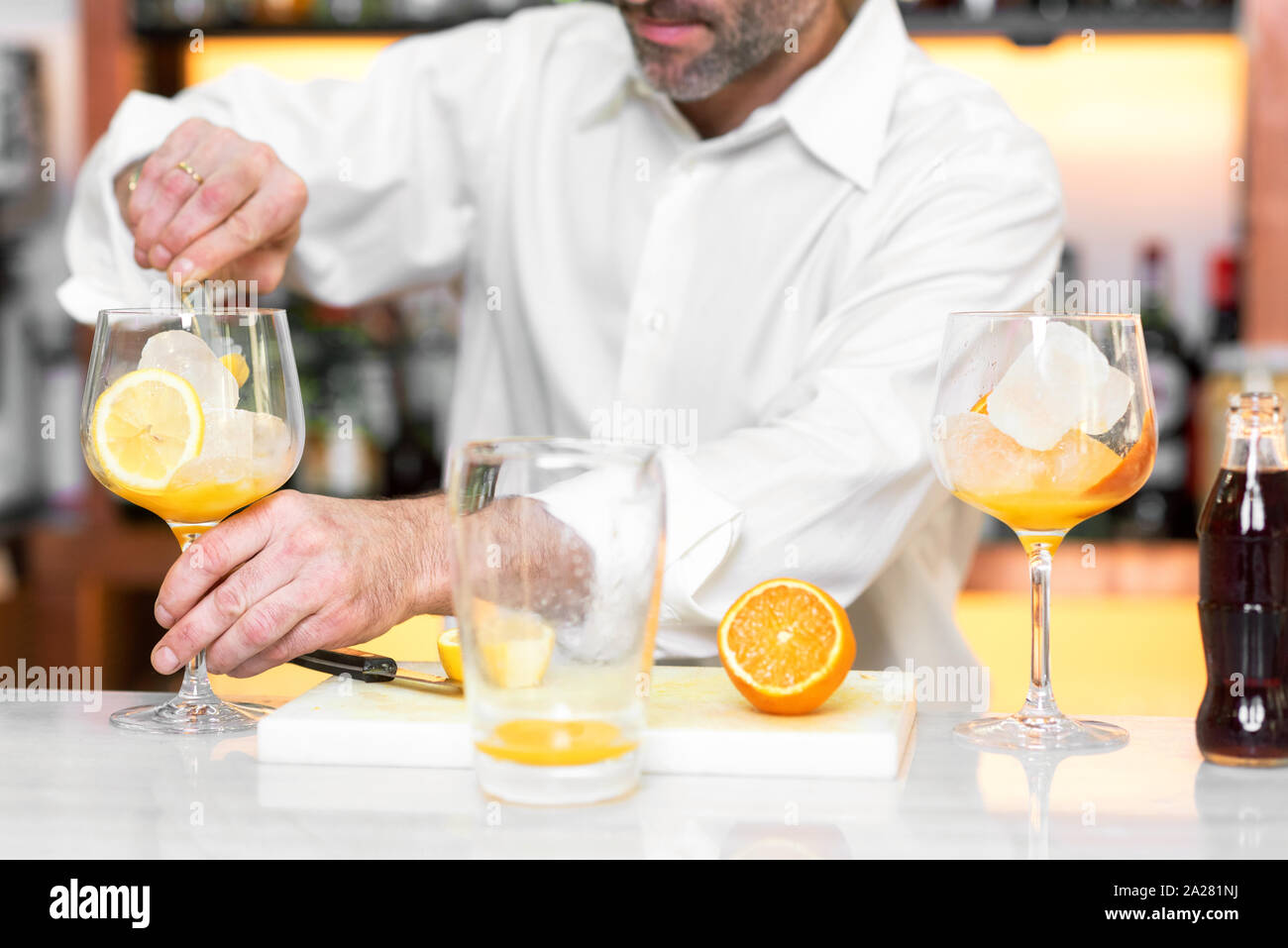 Expert barman is making cocktail at night club Stock Photo - Alamy