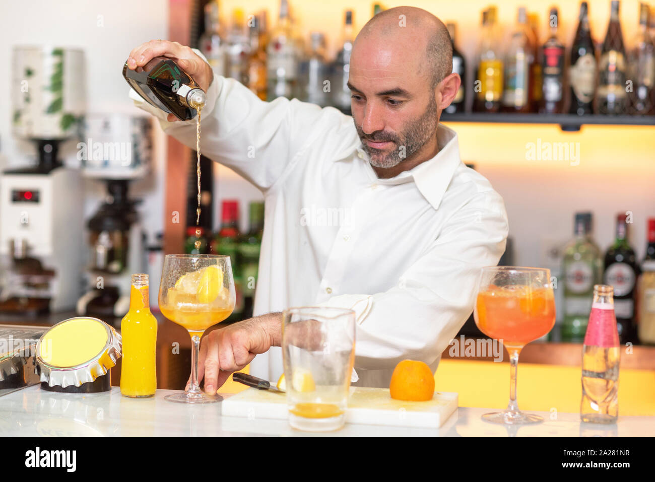 Expert barman is making cocktail at night club Stock Photo - Alamy