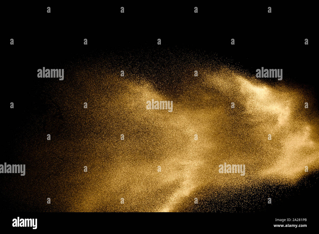 Sand explosion isolated on black background. Freeze motion of sandy ...