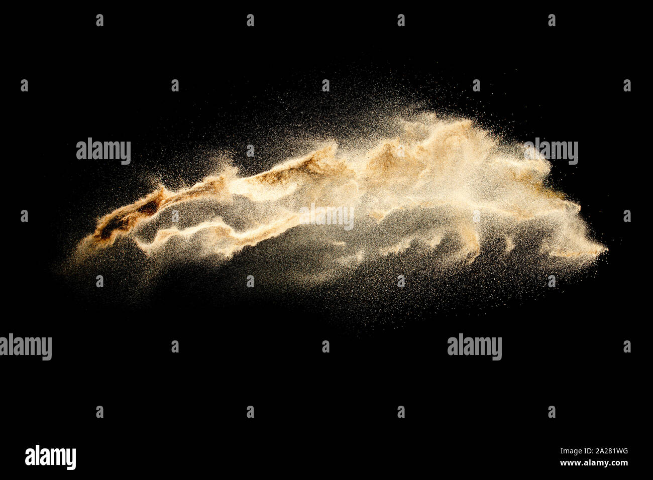 Sand explosion isolated on black background. Freeze motion of sandy ...