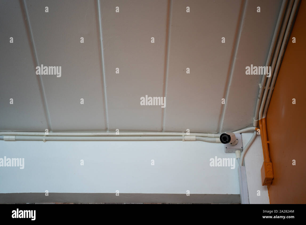 A CCTV security camera installed on ceiling building Stock Photo - Alamy