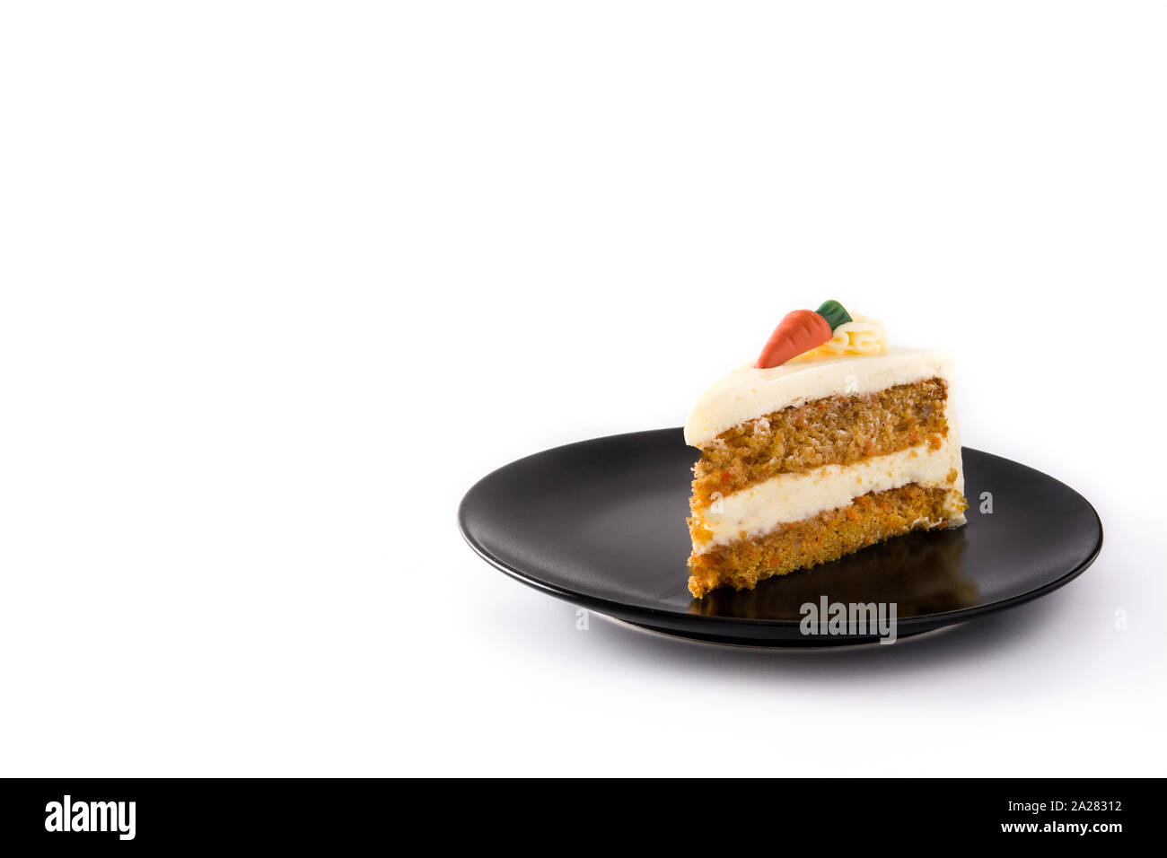 Sweet carrot cake slice on a plate isolated on white background. Copy ...