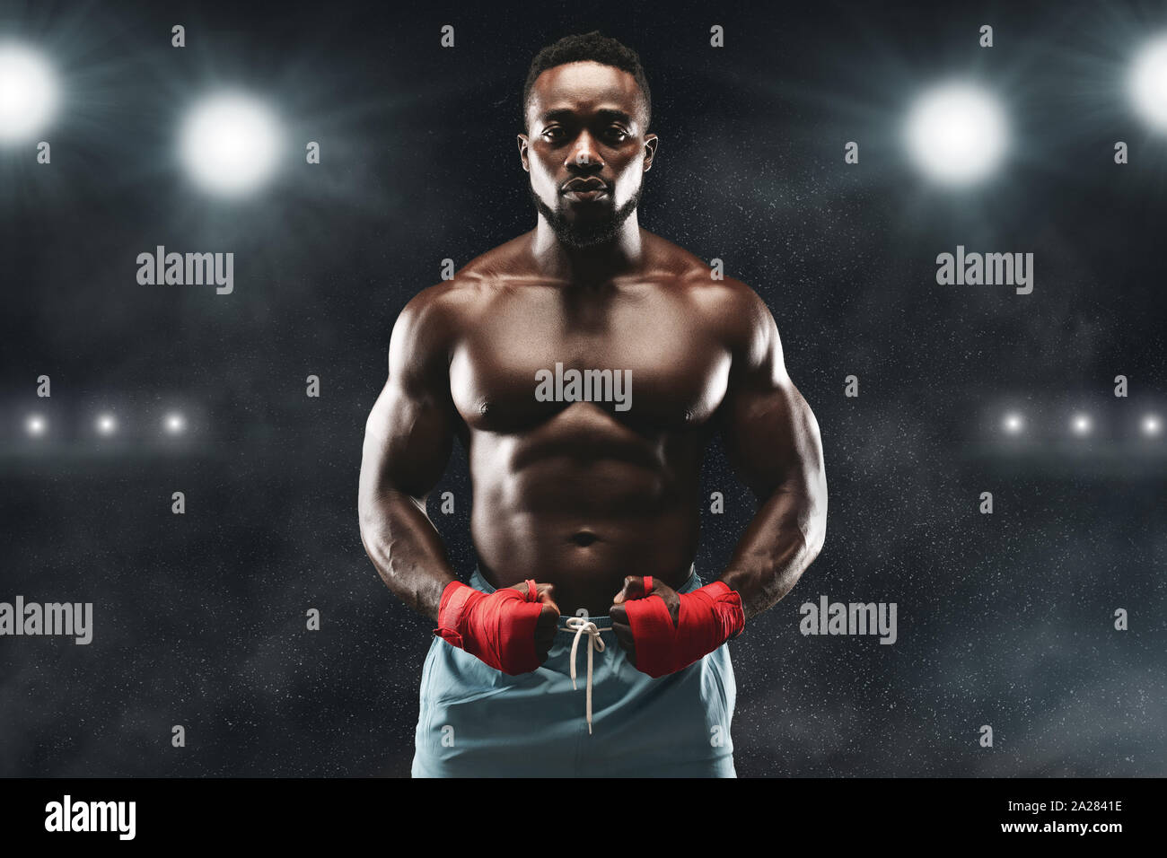 Muscular professional fighter standing on stadium boxing ring Stock ...