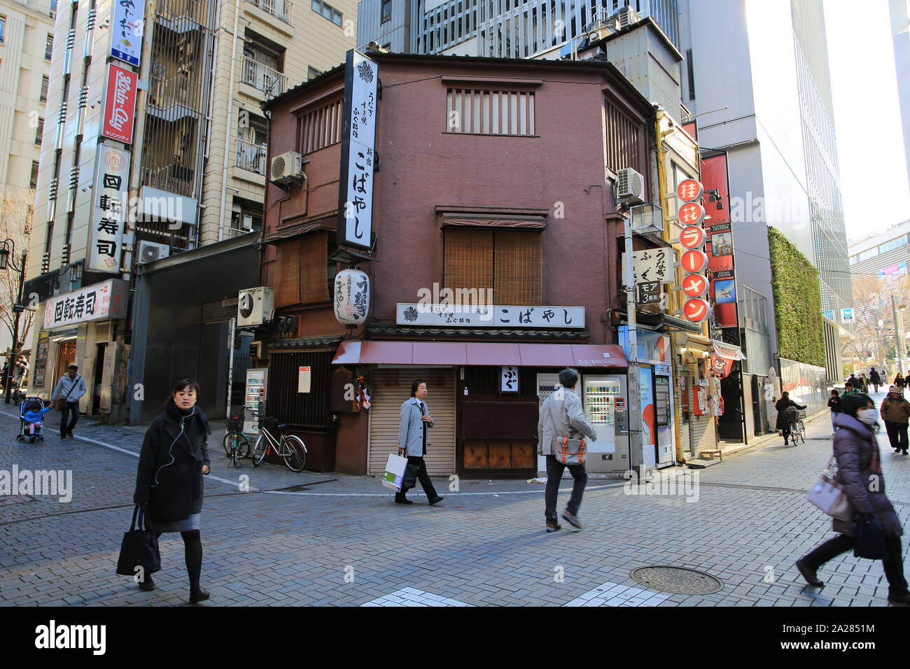 japanese cross the road on Shibuya street. Shibuya is one of the famous ...