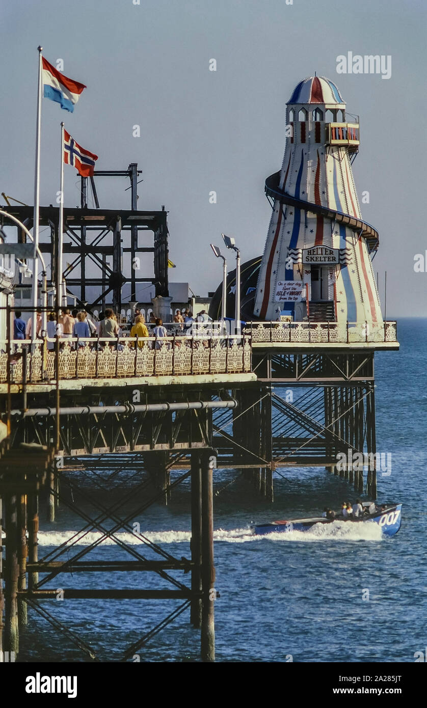 Passenger speed boat excursion traveling under the Palace pier ...
