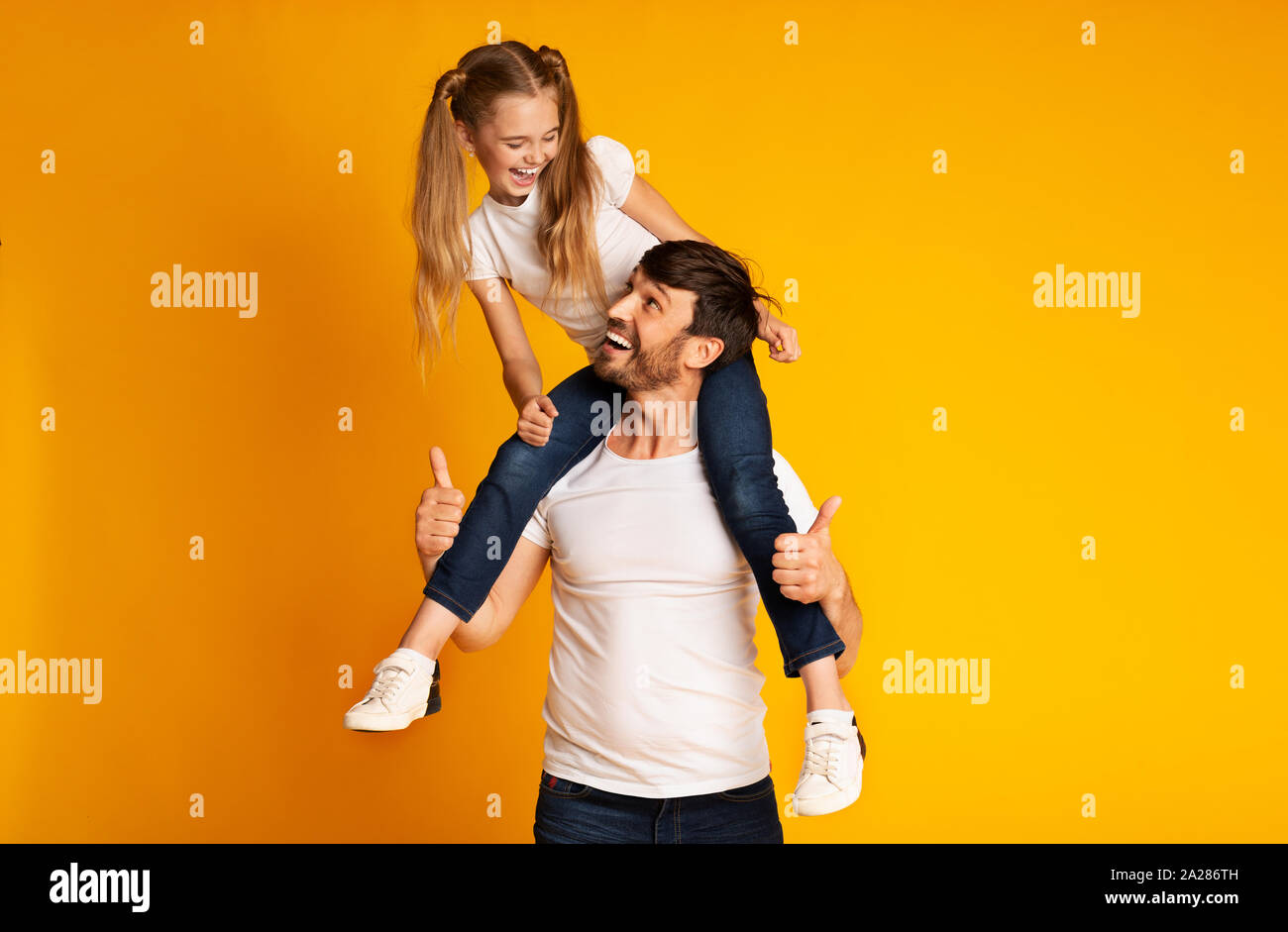 Child sitting on dads shoulders hi-res stock photography and images - Alamy