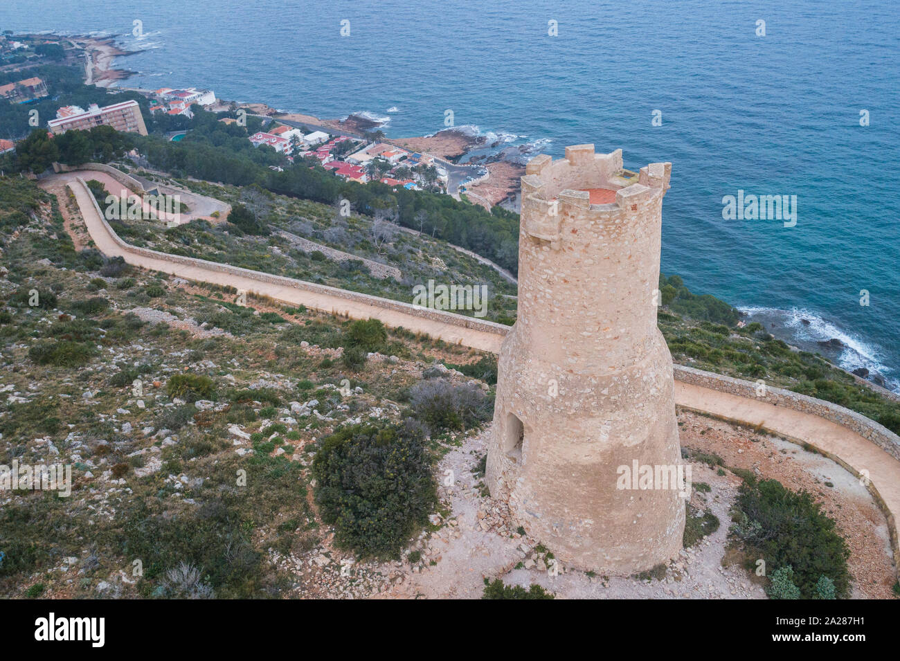 Watchtower next to the sea in Denia Stock Photo - Alamy