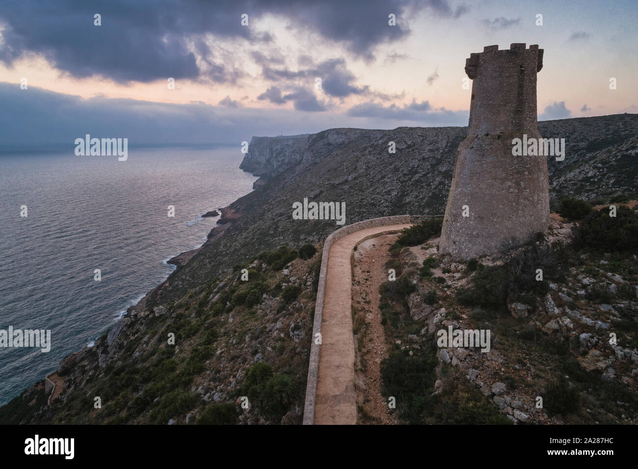 Watchtower next to the sea in Denia Stock Photo - Alamy