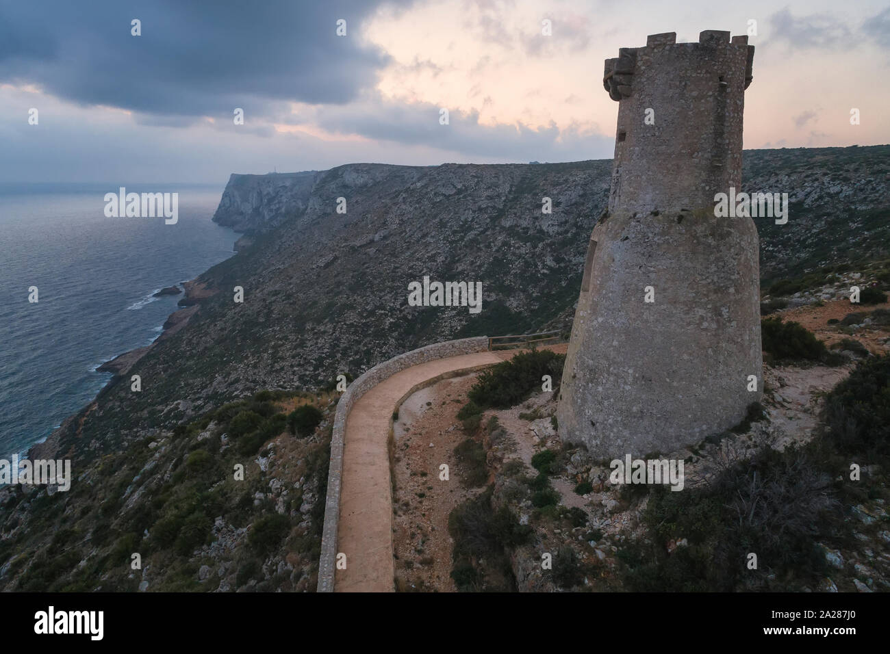 Watchtower next to the sea in Denia Stock Photo - Alamy