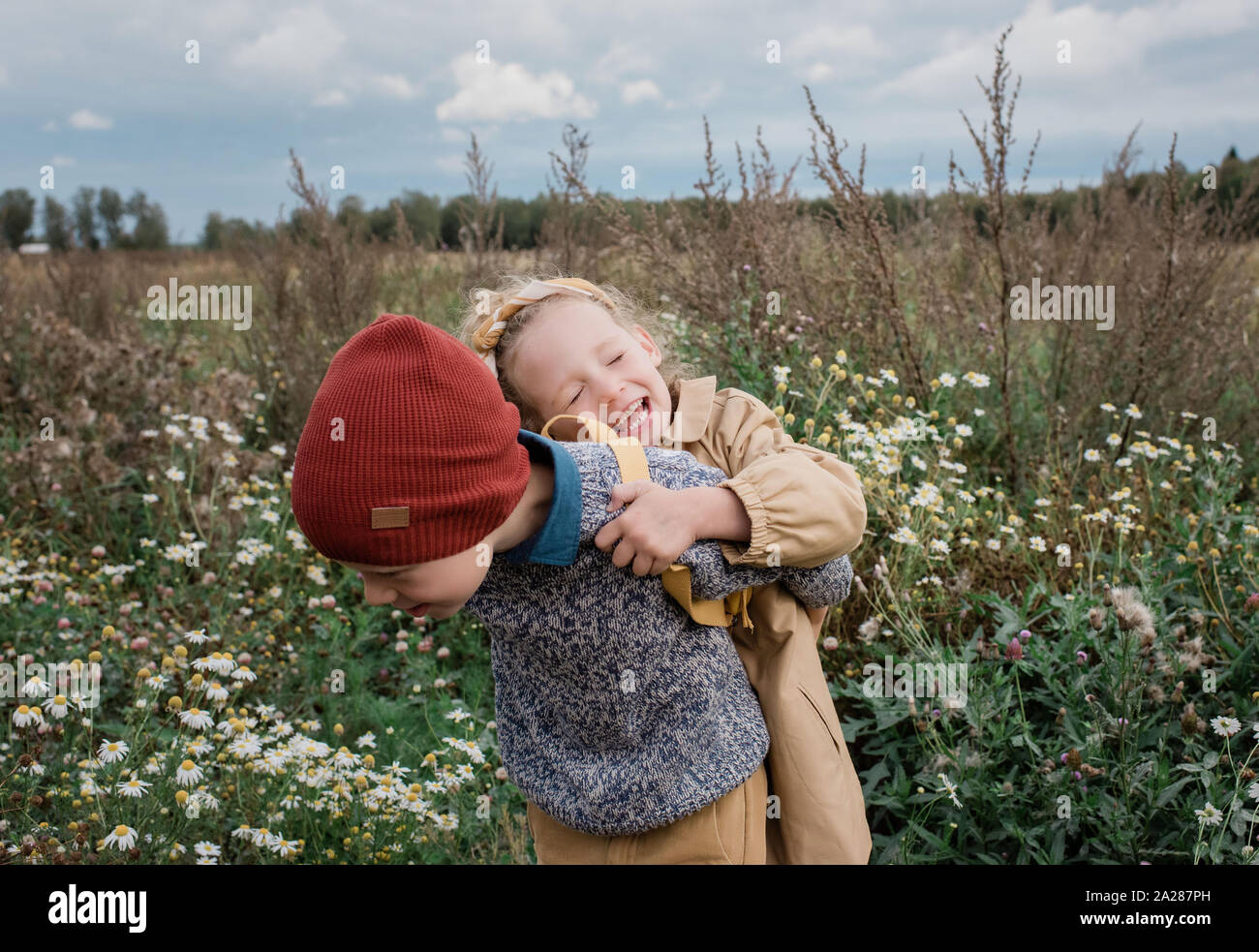 Girl Carrying Baby Brother Sister High Resolution Stock Photography and ...
