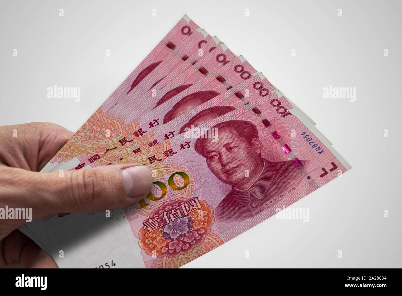 Hand holding Chinese Renminbi. RMB. Currency of China Stock Photo - Alamy