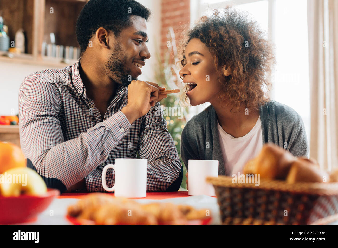 Woman feeding girlfriend breakfast hi-res stock photography and images ...
