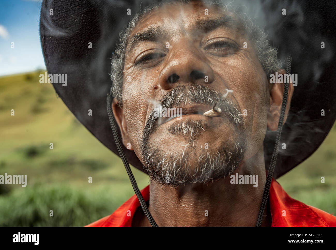 Portrait of Brazilian cowboy smoking handmade cigarette Stock Photo - Alamy