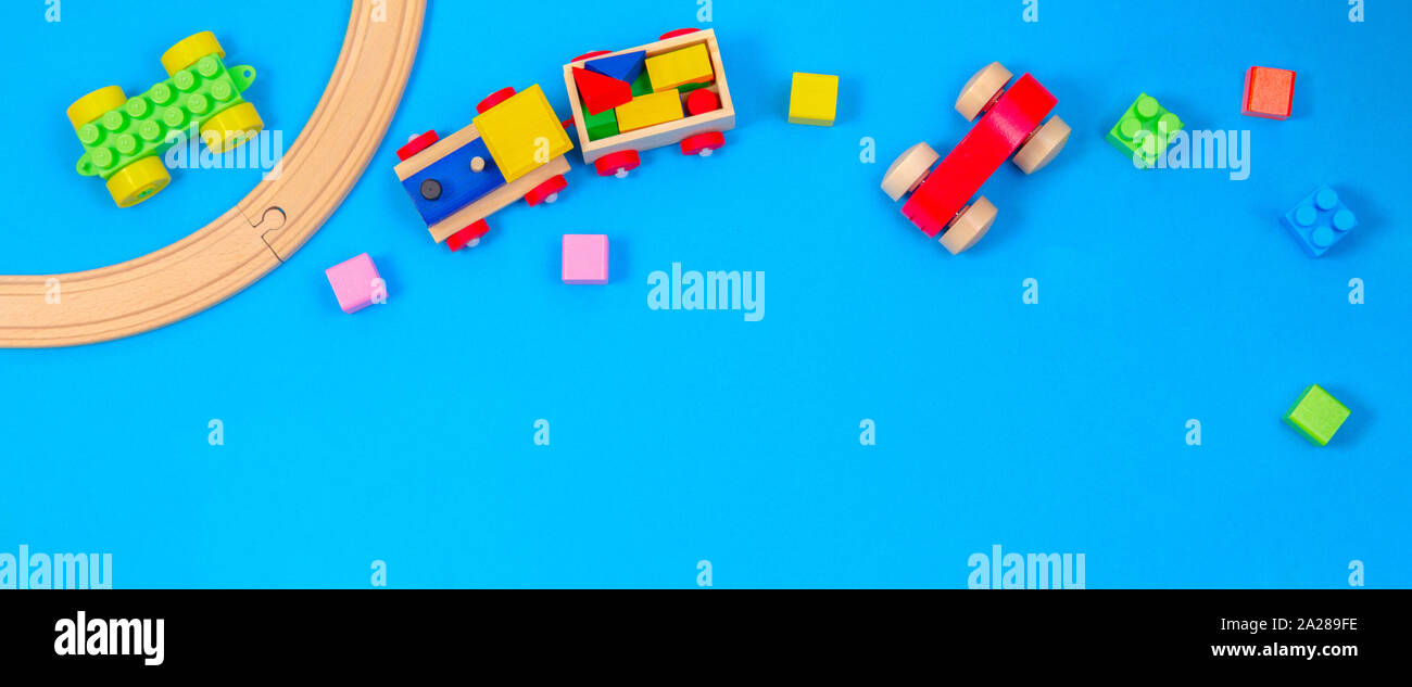 Kids toys background with teddy bear, wooden train and colorful blocks ...