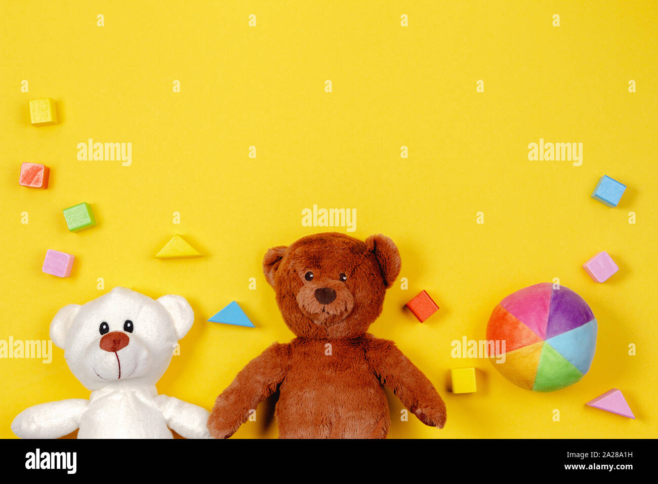 Kids baby toy background with teddy bear, wooden bricks and other toys ...