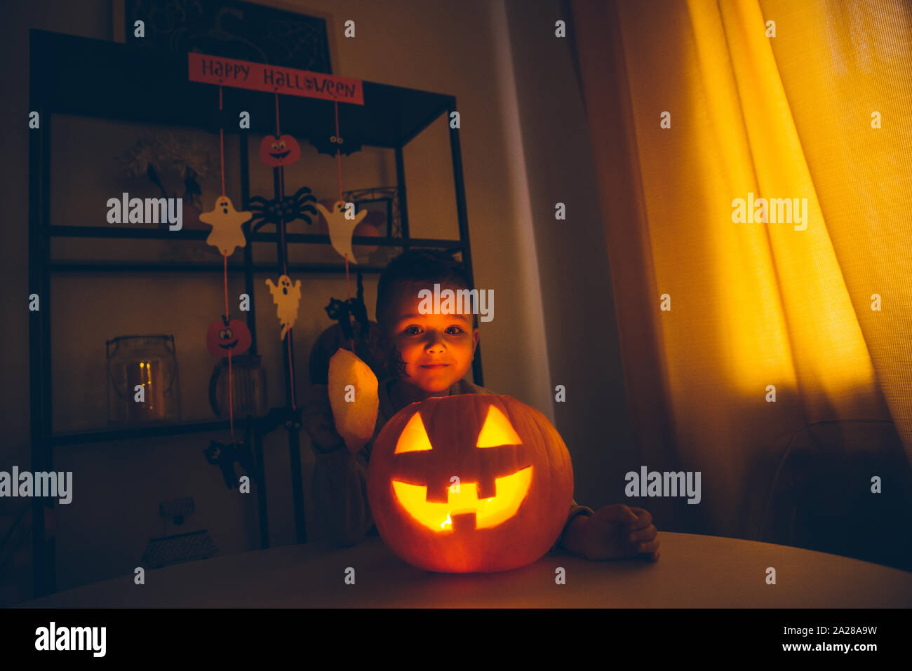 little boy making pumpkins head from paper Stock Photo - Alamy