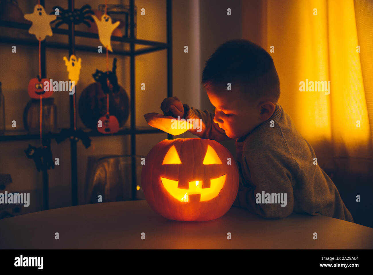 little boy making pumpkins head from paper Stock Photo - Alamy