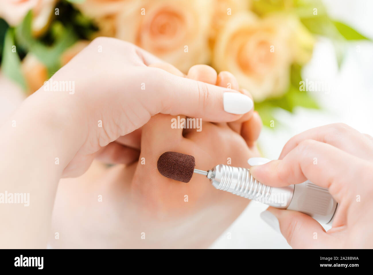 Podiatrist in podiatry session working of feet of client Stock Photo ...