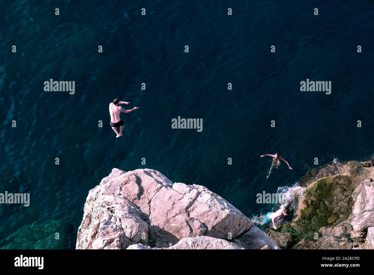 Young woman dive rocks hi-res stock photography and images - Alamy
