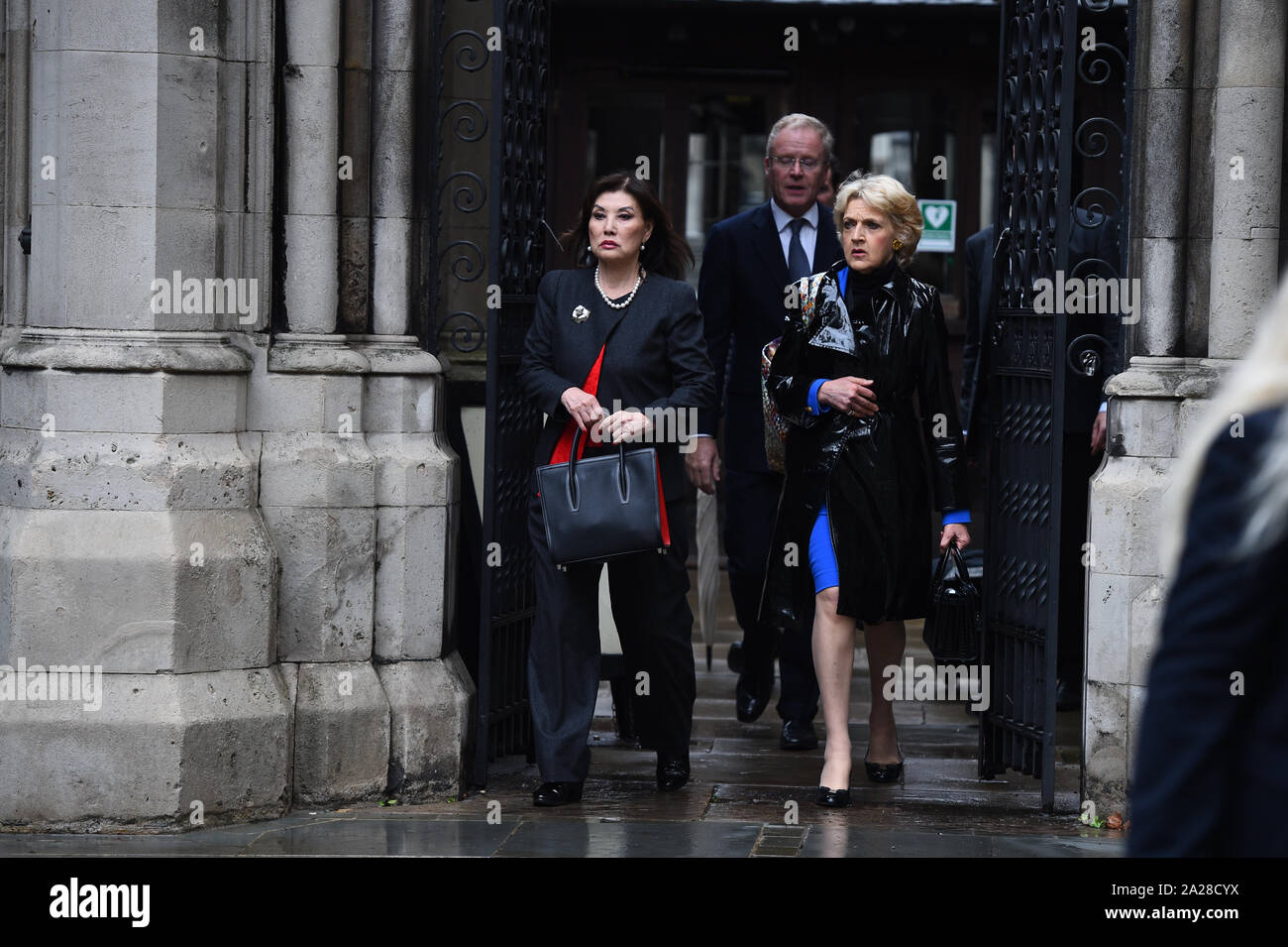 Lady Hiroko Barclay (left) leaves the High Court in London, follow a ...