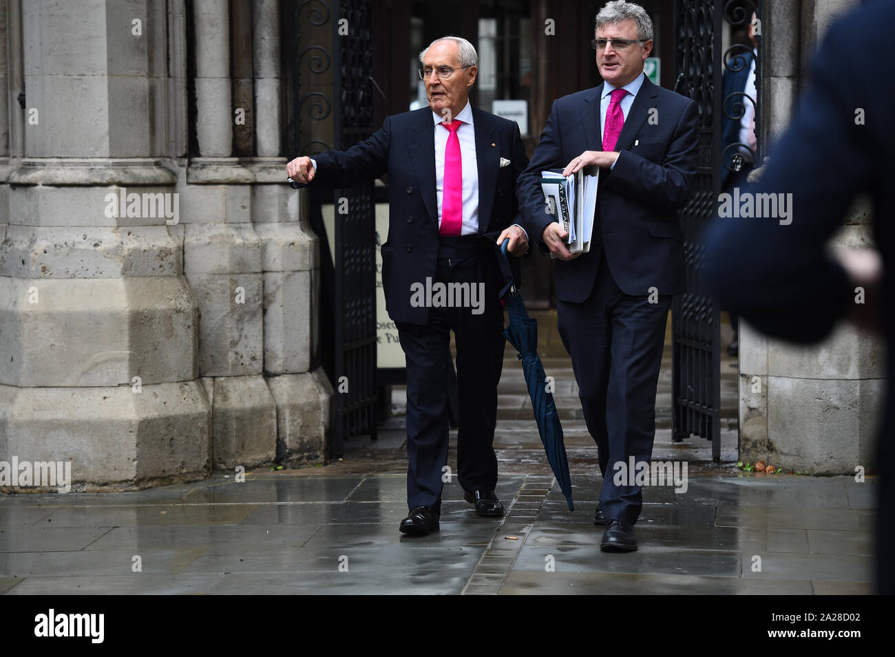 Sir Frederick Barclay (left) leaves the High Court in London, follow a ...