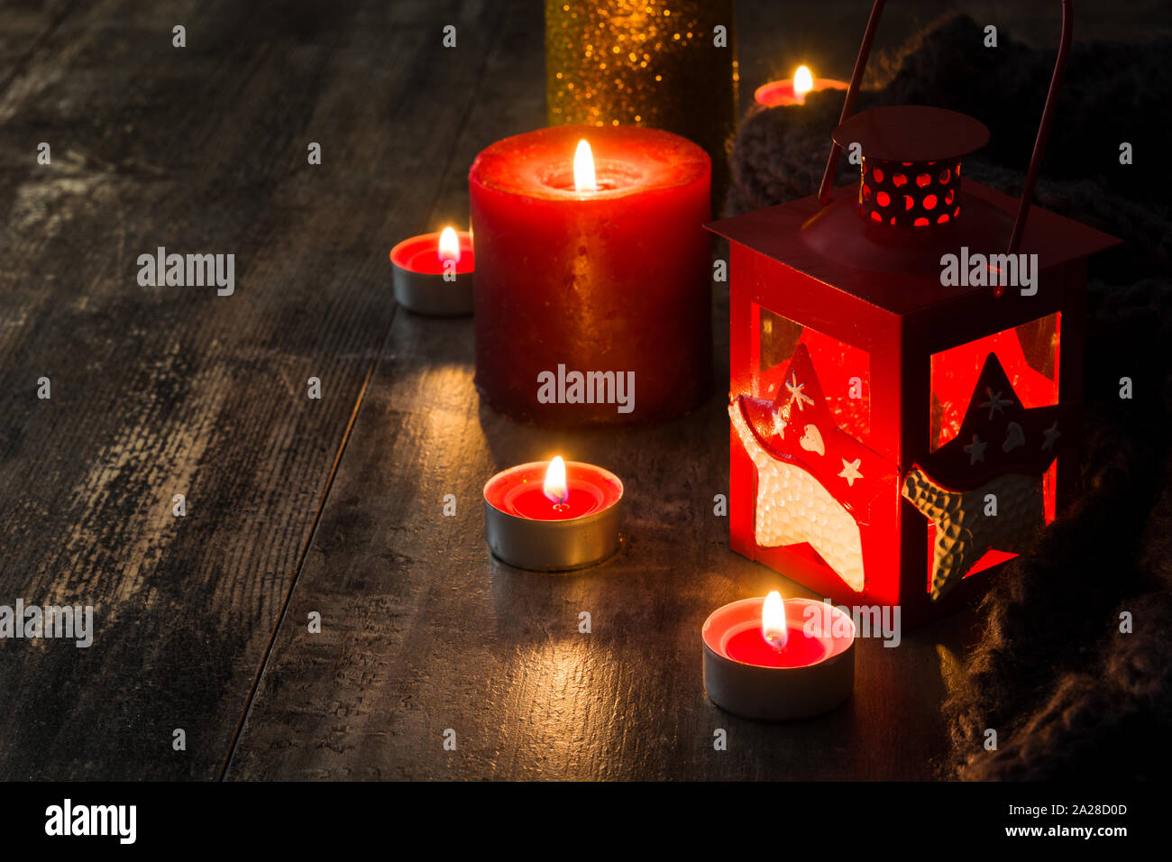 Christmas candles on wooden table. Dim light. Copy space Stock Photo ...