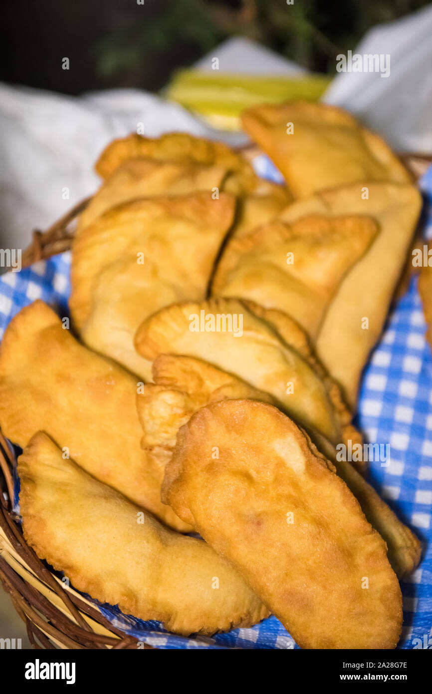 Apulian food: fried pies called panzerotti in a basket, made with ...
