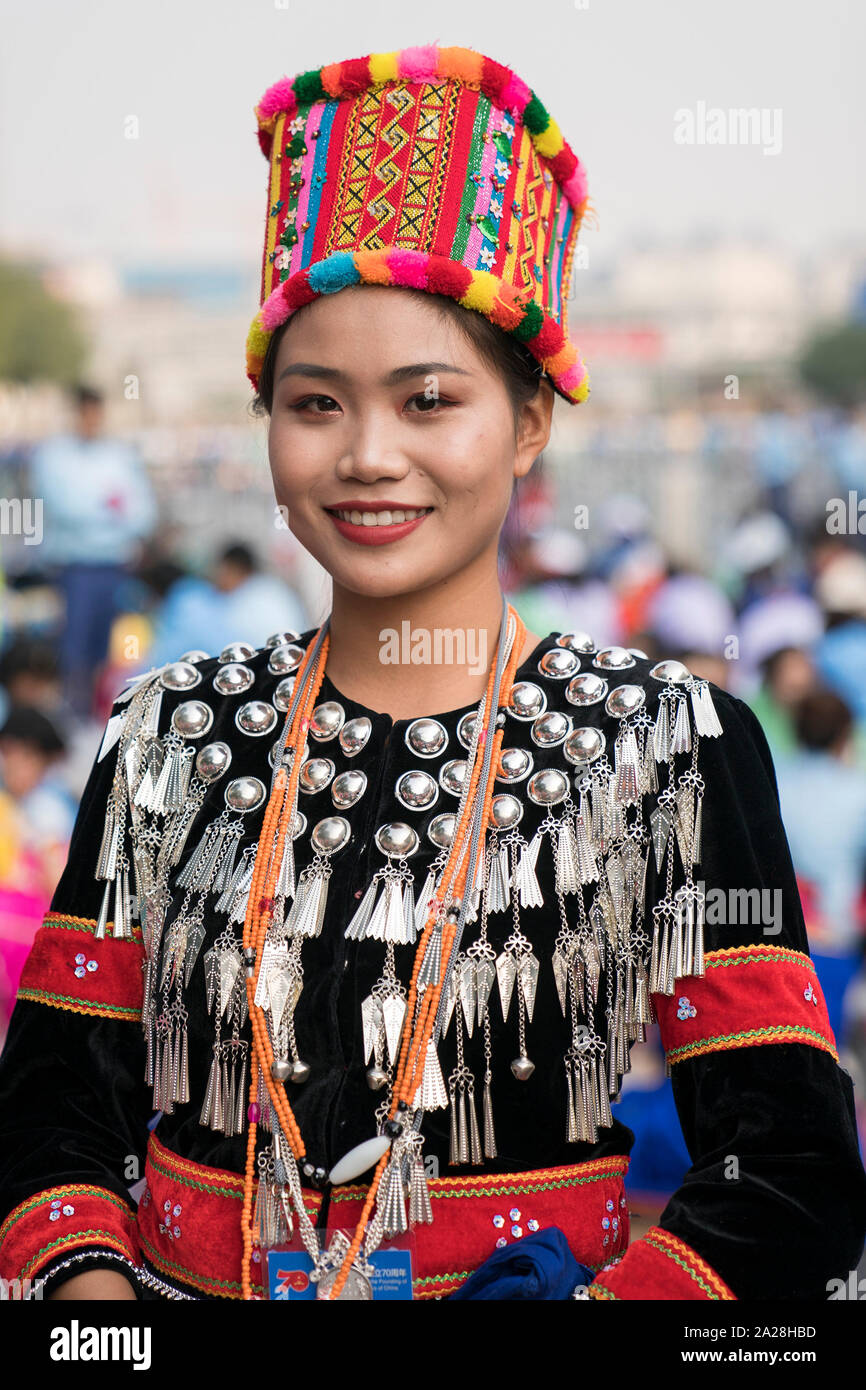 Beijing, China. 1st Oct, 2019. Sun Zhihan of Jingpo ethnic group poses for a photo before ...
