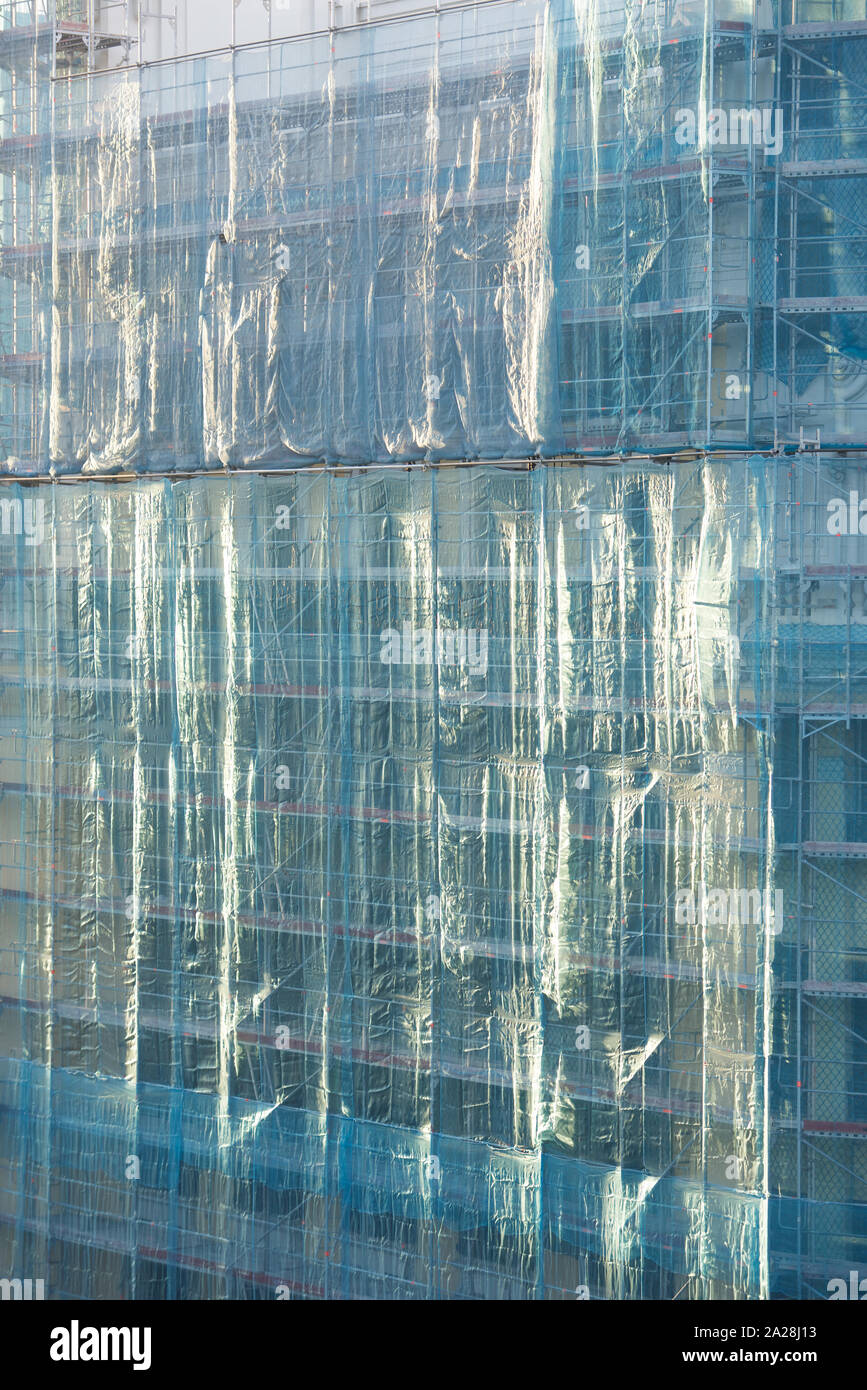 Abstract - detail of building covered in scaffolding and cover Stock ...