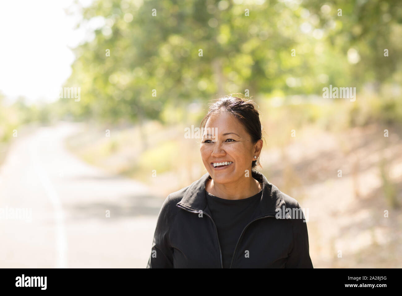 Portrait of a fit Asian woman exercising Stock Photo - Alamy