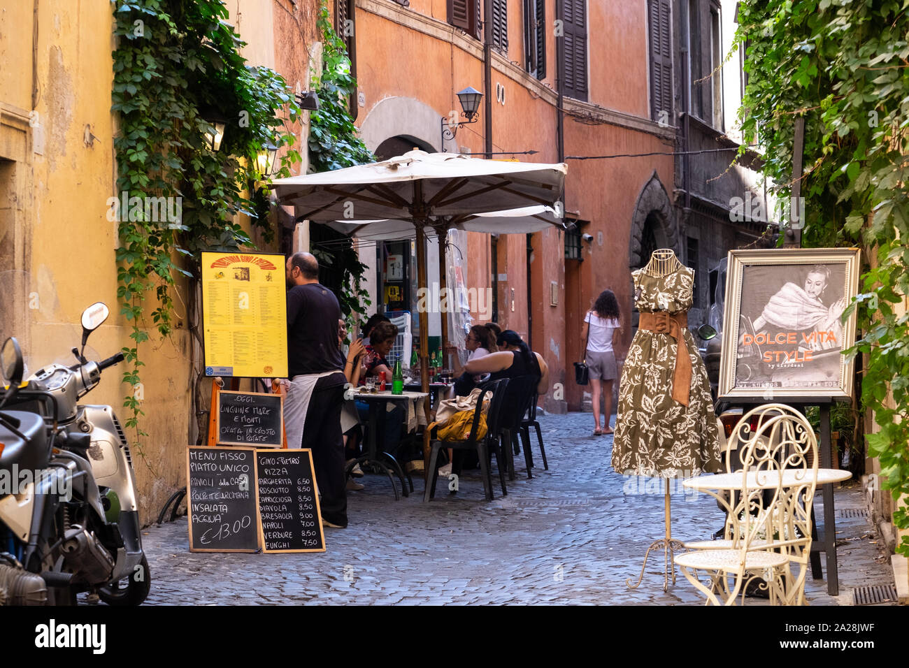 Timeless traditional coloured scene of outdoor restaurant and shop ...